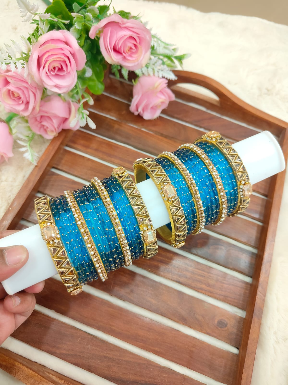 Simple and elegant golden triangle model mixed with blue glass bangles ...